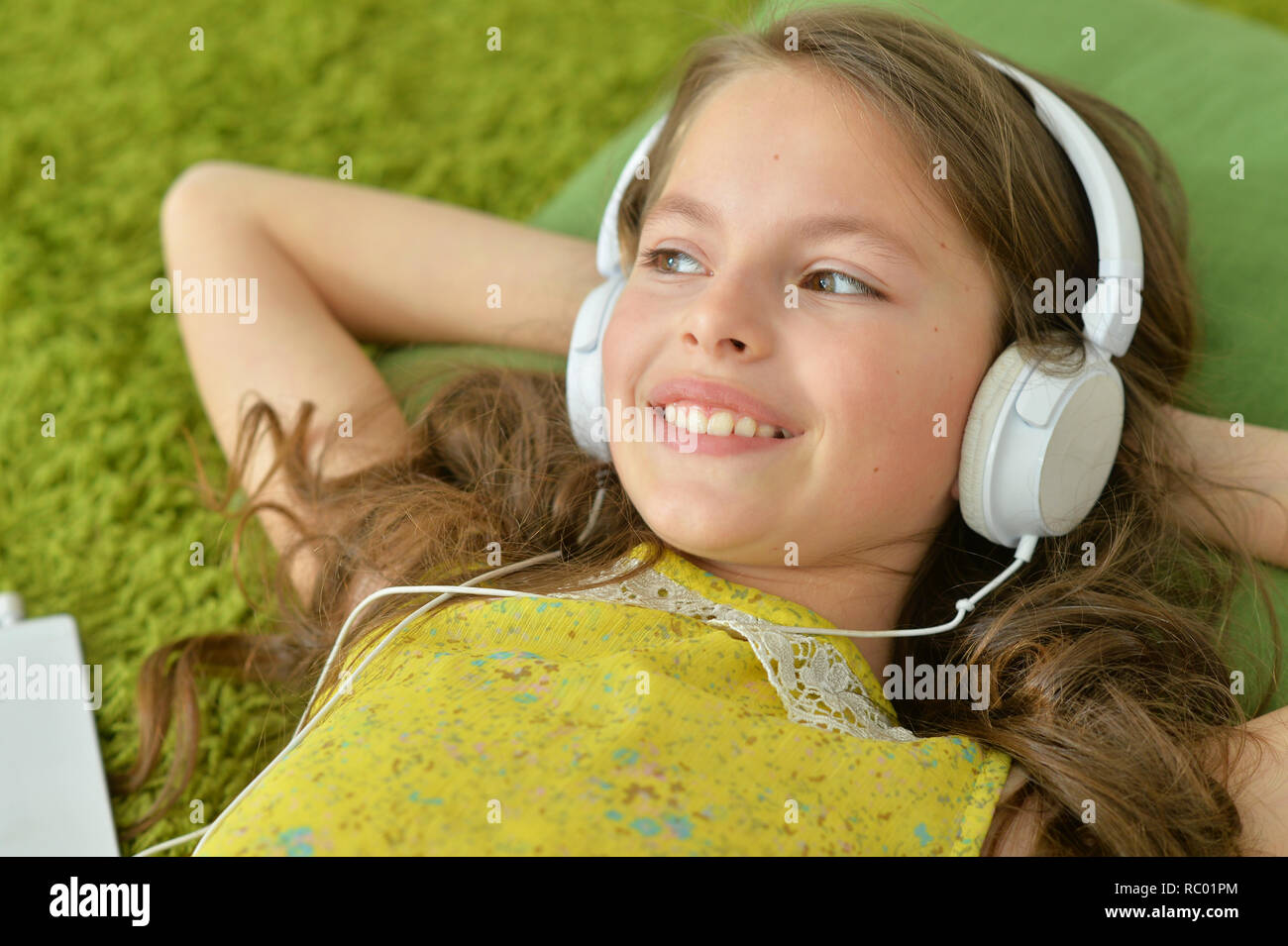 Portrait of cute little girl with headphones Stock Photo - Alamy