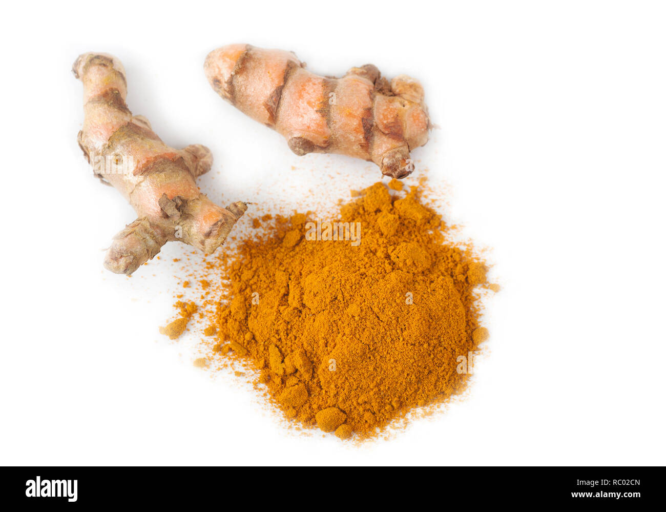 Turmeric root and ground turmeric on white background Stock Photo - Alamy