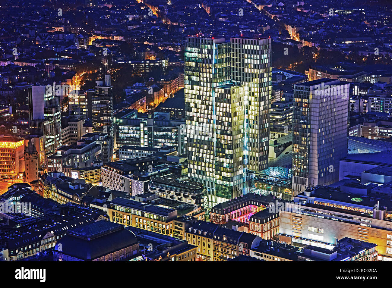 Aerial view of skyscrapers in centre of Frankfurt illuminated at night ...