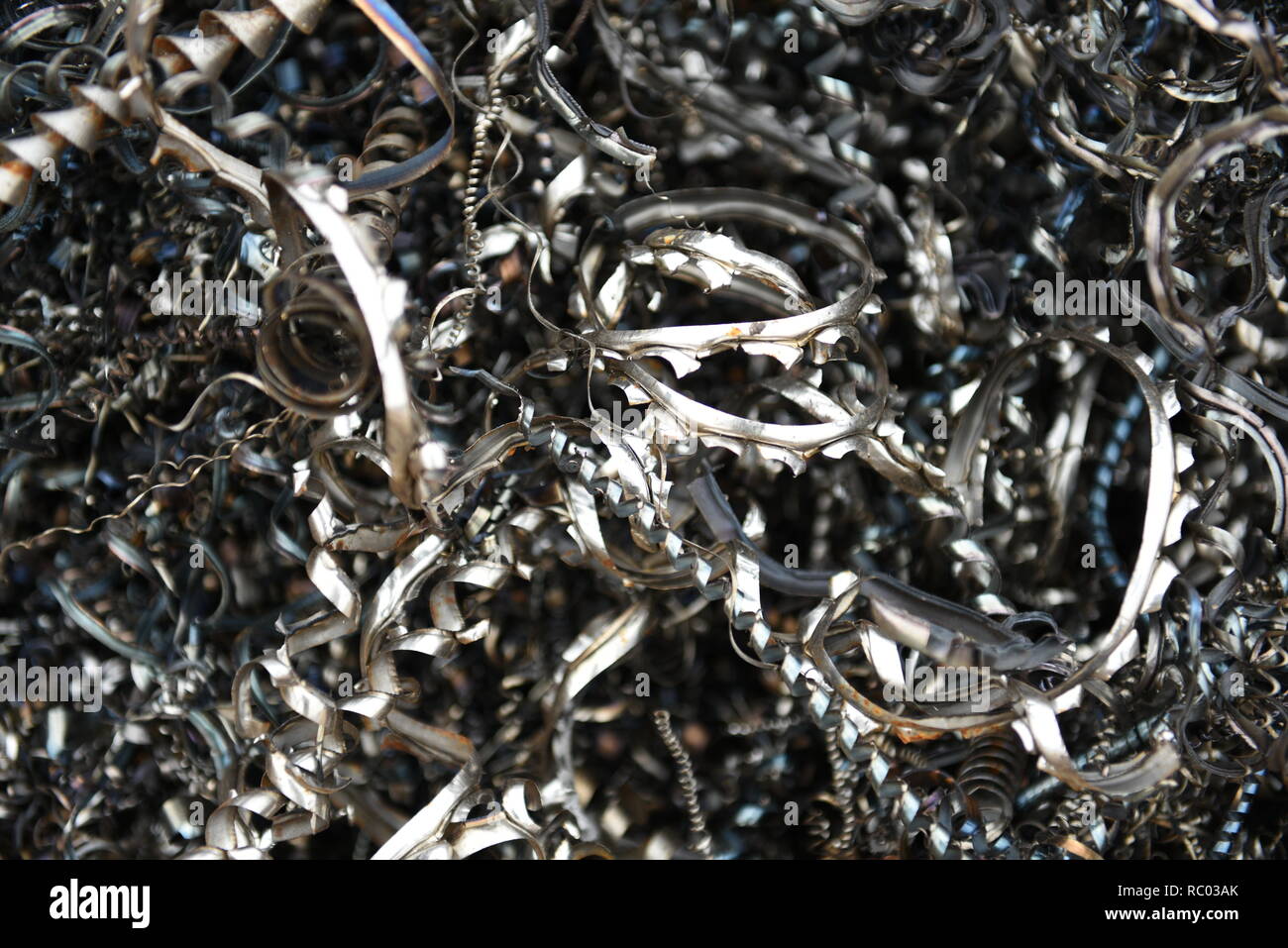 Discarded tangled twisted pieces raw industrial scrap metal waste ...
