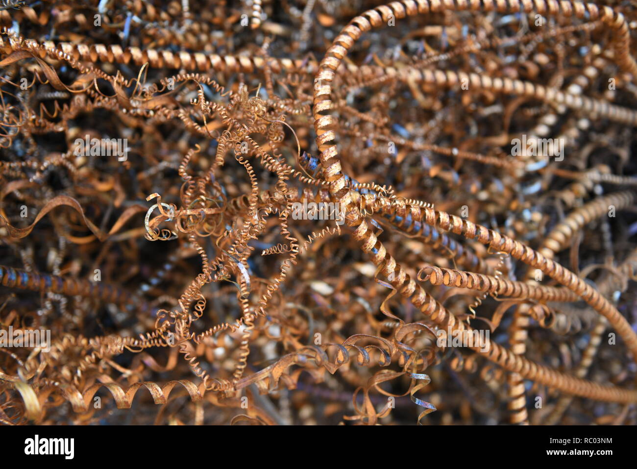 Tangled twisted pile of discarded industrial scrap metal waste debris ...