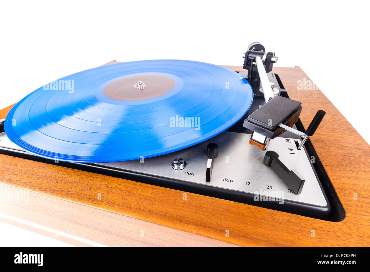 Vintage turntable with a blue vinyl isolated on white. Wooden plinth ...