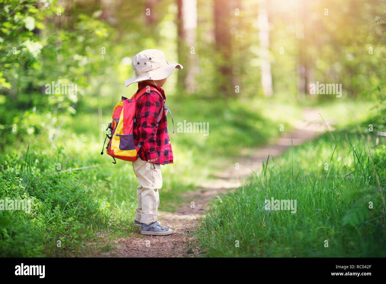 boy going camping with backpack in nature Stock Photo - Alamy