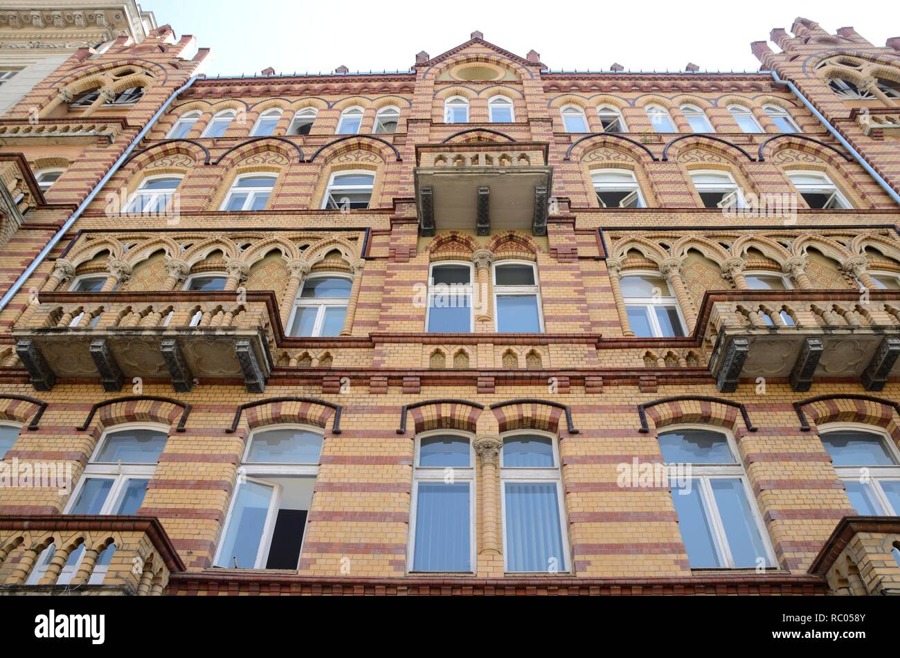 Red and yellow brick building in Warsaw, Poland Stock Photo - Alamy