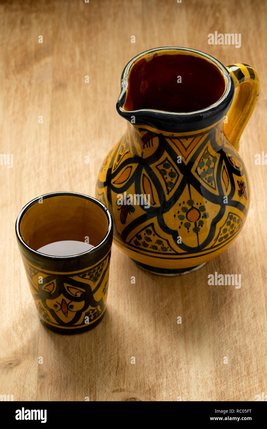 Traditional decorated Moroccan cup and jar with fresh water Stock Photo ...