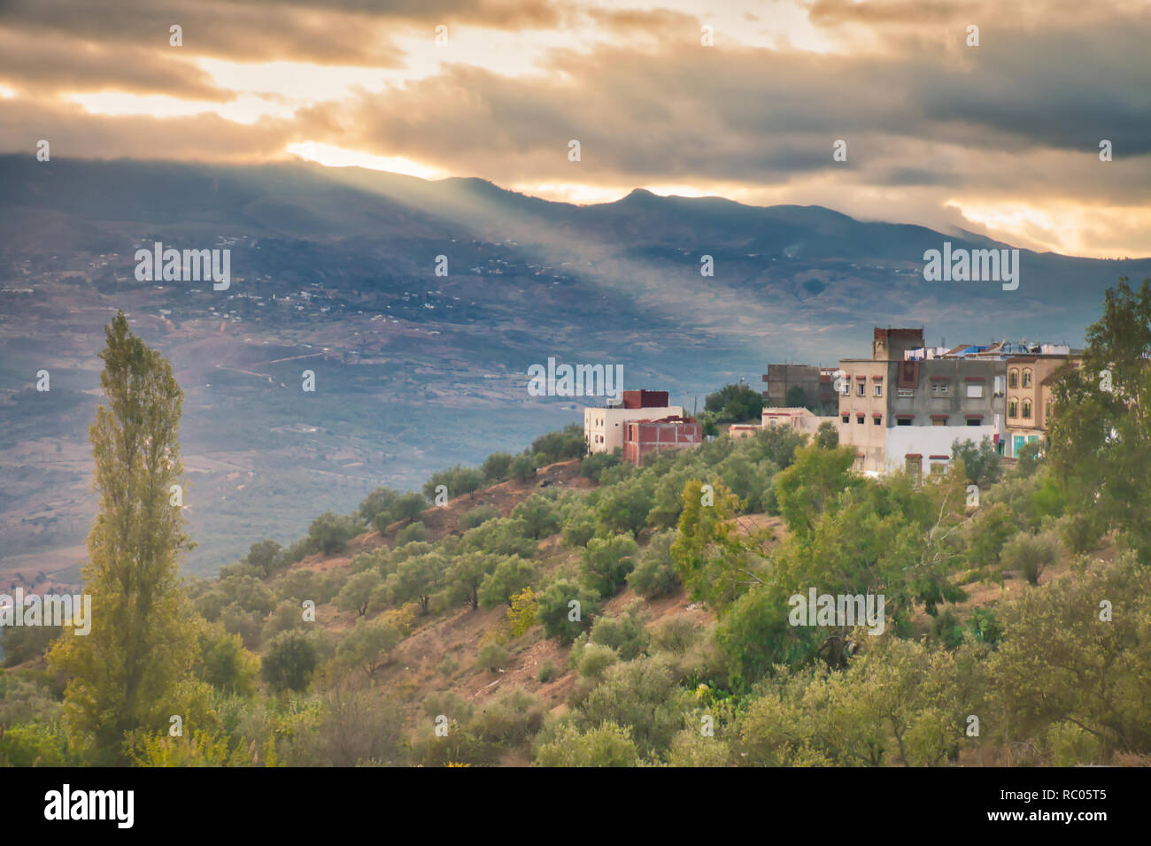 Landscape near Chefchaouen, with a ray of sun rising through the clouds ...