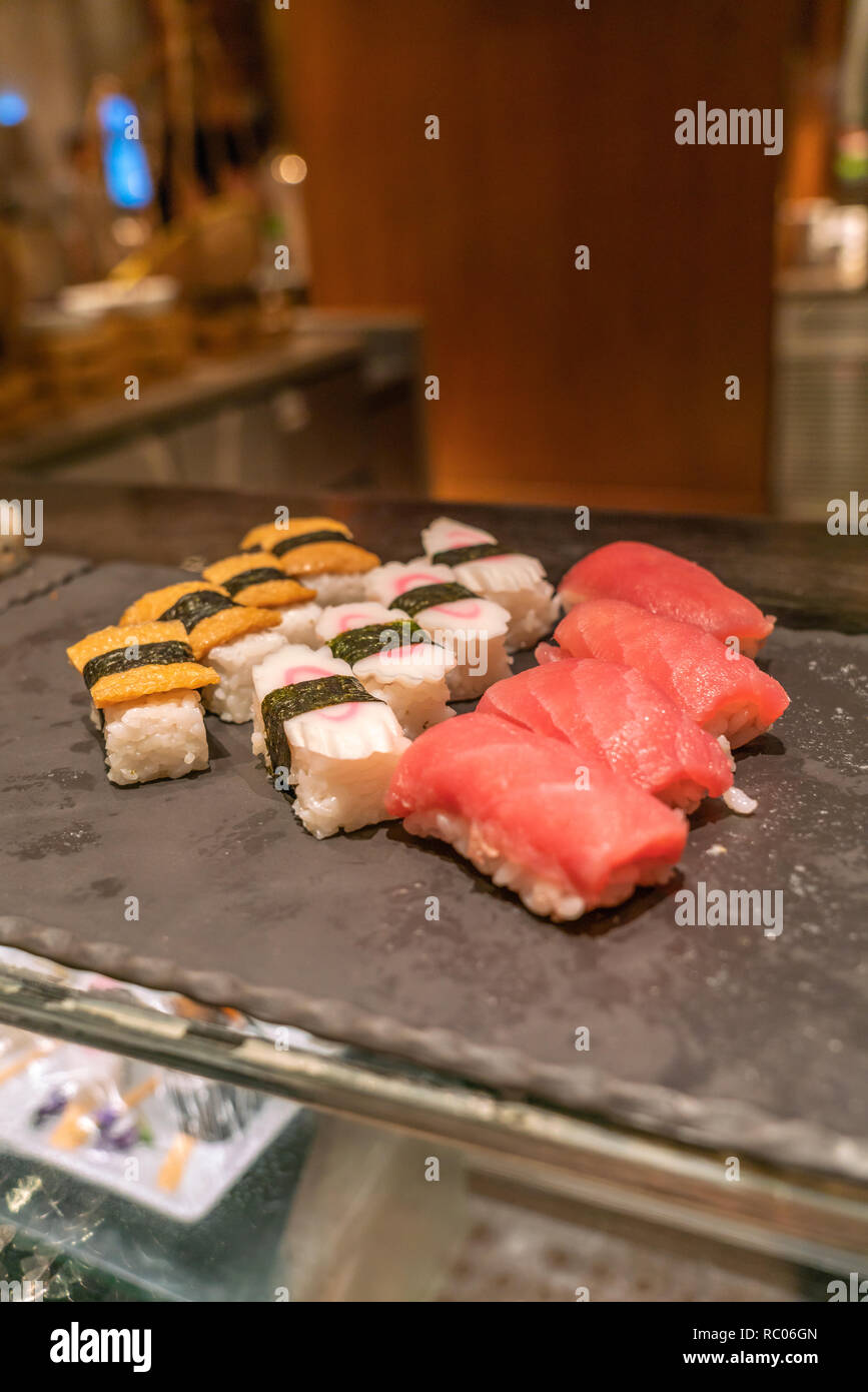 Vertical photo of Japanese sushi in the buffet Stock Photo - Alamy