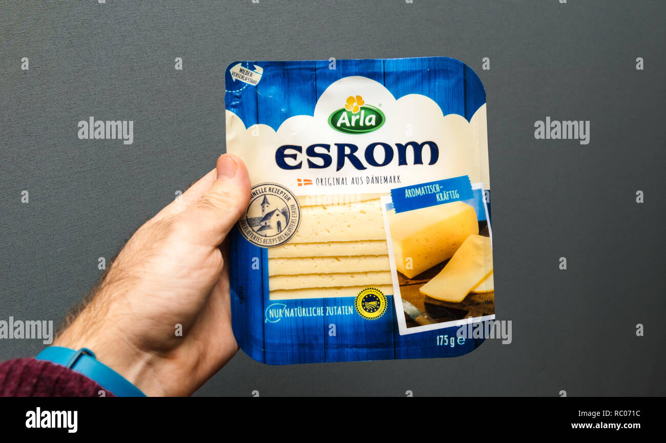 PARIS, FRANCE - JAN 23, 2018: Man holding Esrom traditional Danish ...