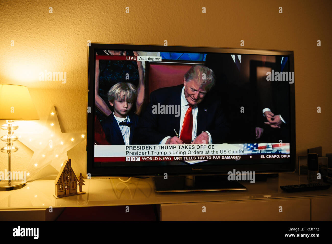 PARIS, FRANCE - JAN 20, 2017: Man watches BBC News TV news reporting ...