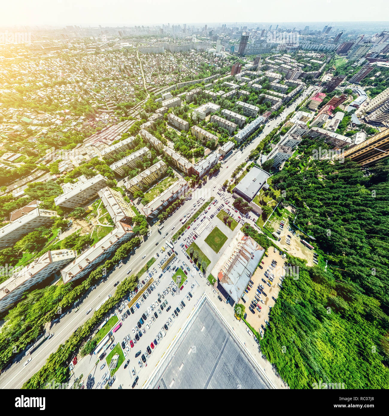 Aerial city view with crossroads and roads, houses, buildings, parks ...