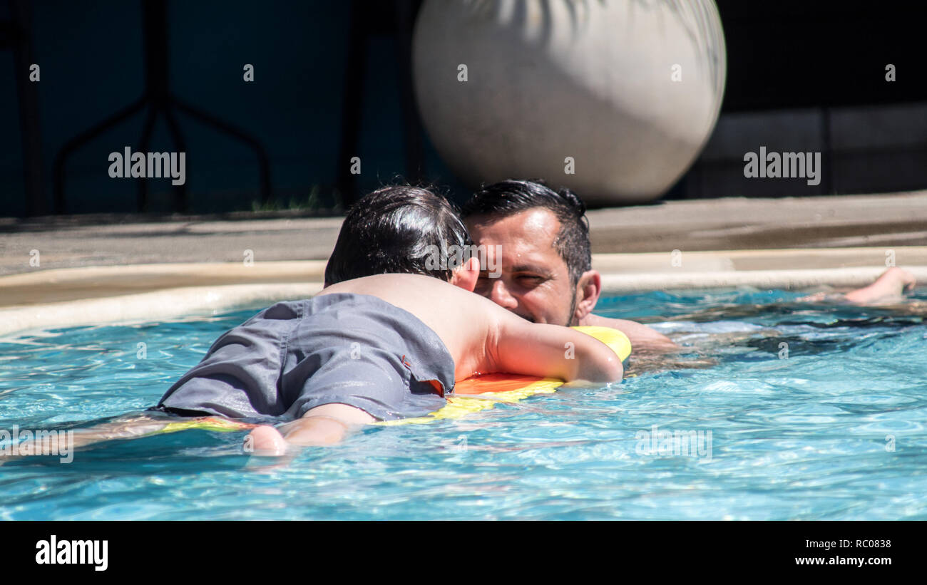 Father and son at swimming pool hi-res stock photography and images - Alamy