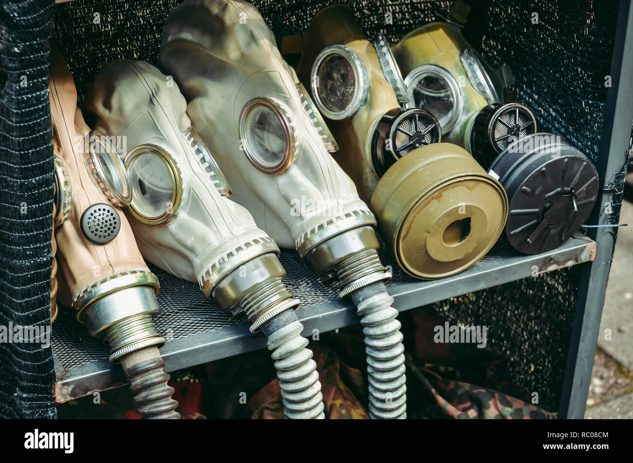 Set of old military gas mask on the shelf Stock Photo - Alamy