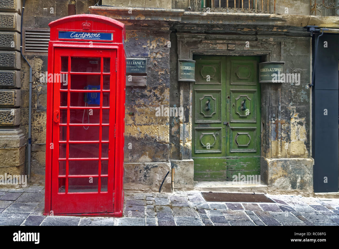 A classic British red telephone box on a street in Malta Stock Photo ...