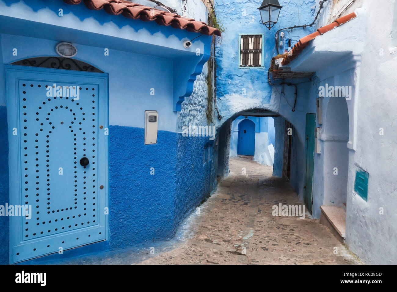 Alley with arches in Chaouen, the so-called blue city, a beautiful town ...