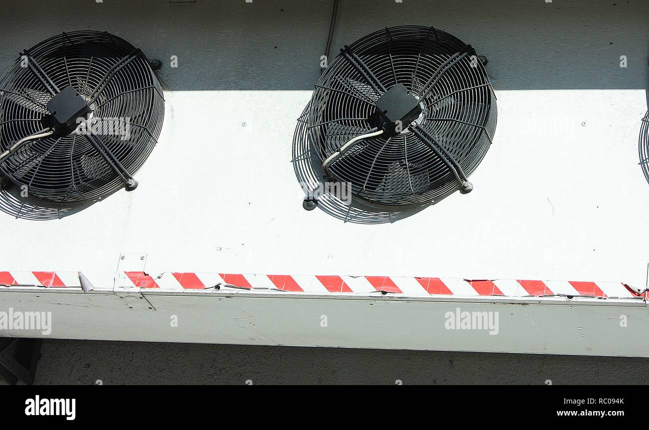 Black ventilation system on a white wall. three horizontal ventilation ...