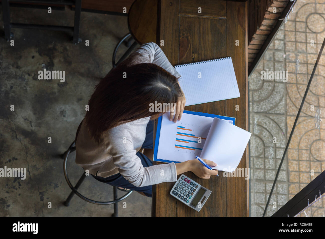 Checking the column report and take note important number Stock Photo ...