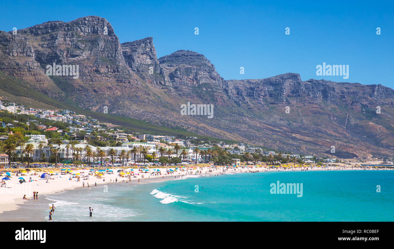 View Camps bay beautiful beach with turquoise water and mountains in ...