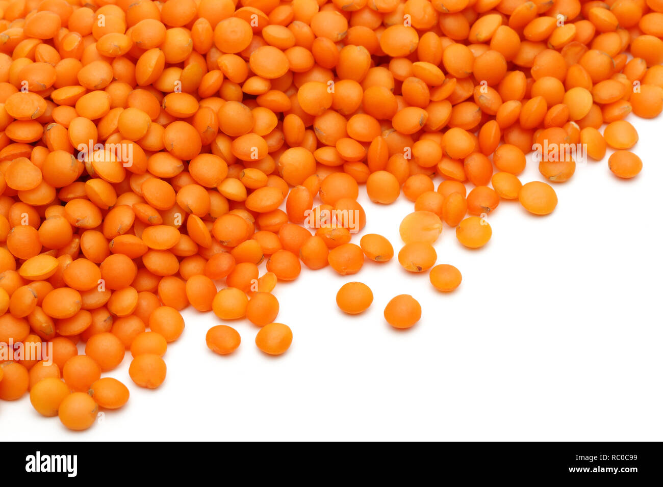 Red lentil isolated on white background Stock Photo - Alamy