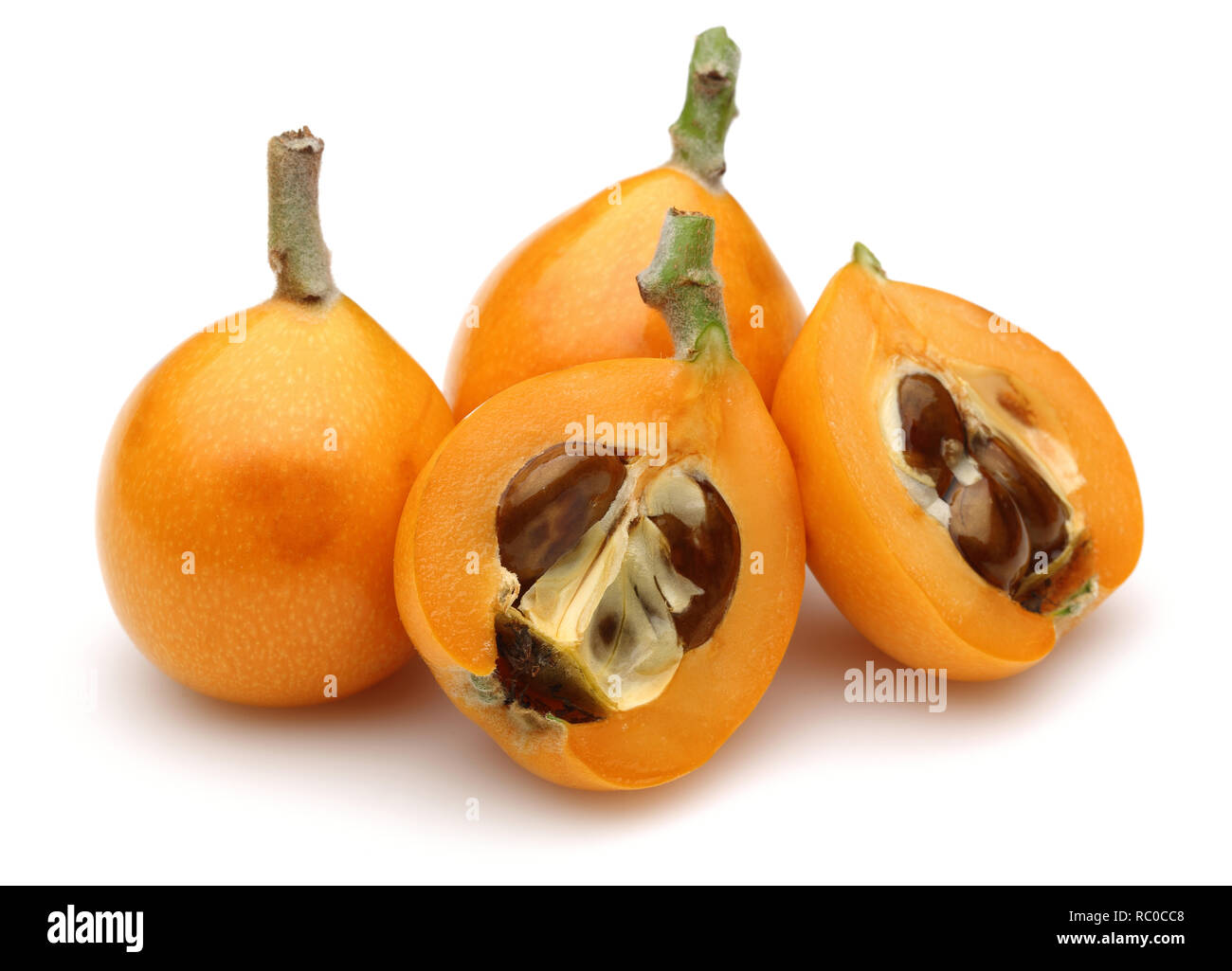 Ripe loquat, half and slice isolated on white background Stock Photo ...