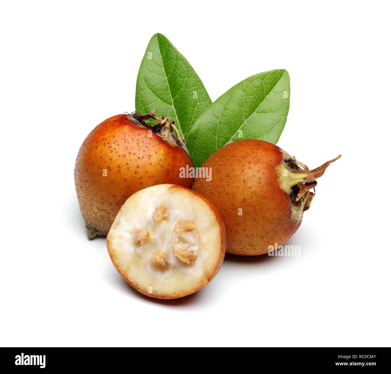 Medlar fruit with green leaves isolated on white background Stock Photo ...