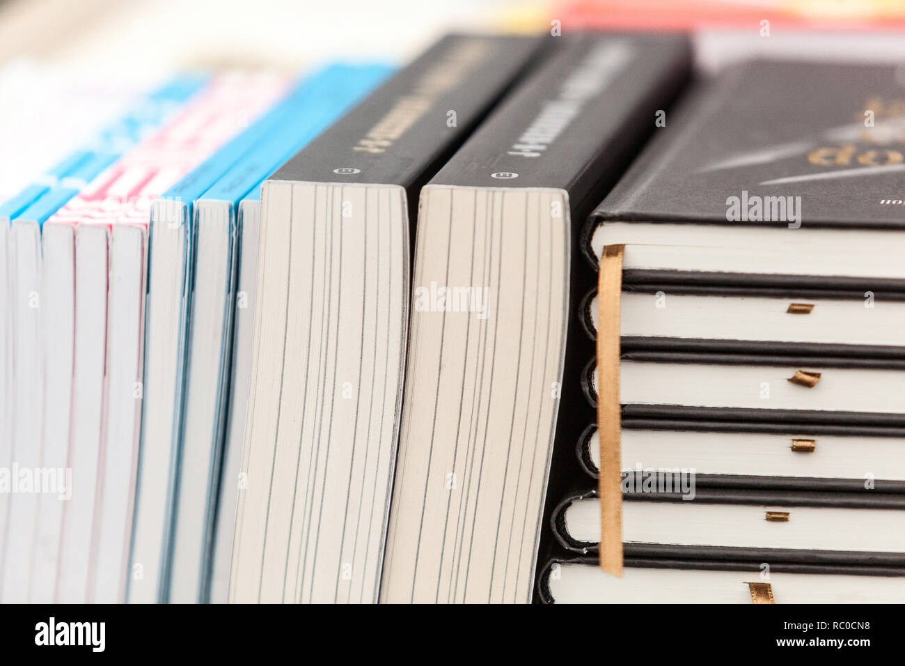 Stacked books on the shelf Stock Photo - Alamy