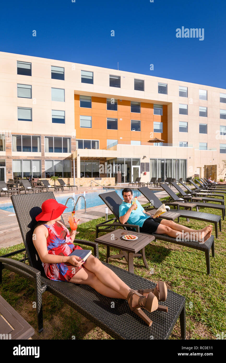 Couple enjoying the swimming pool at the Hyatt Place Hotel, La Paz ...