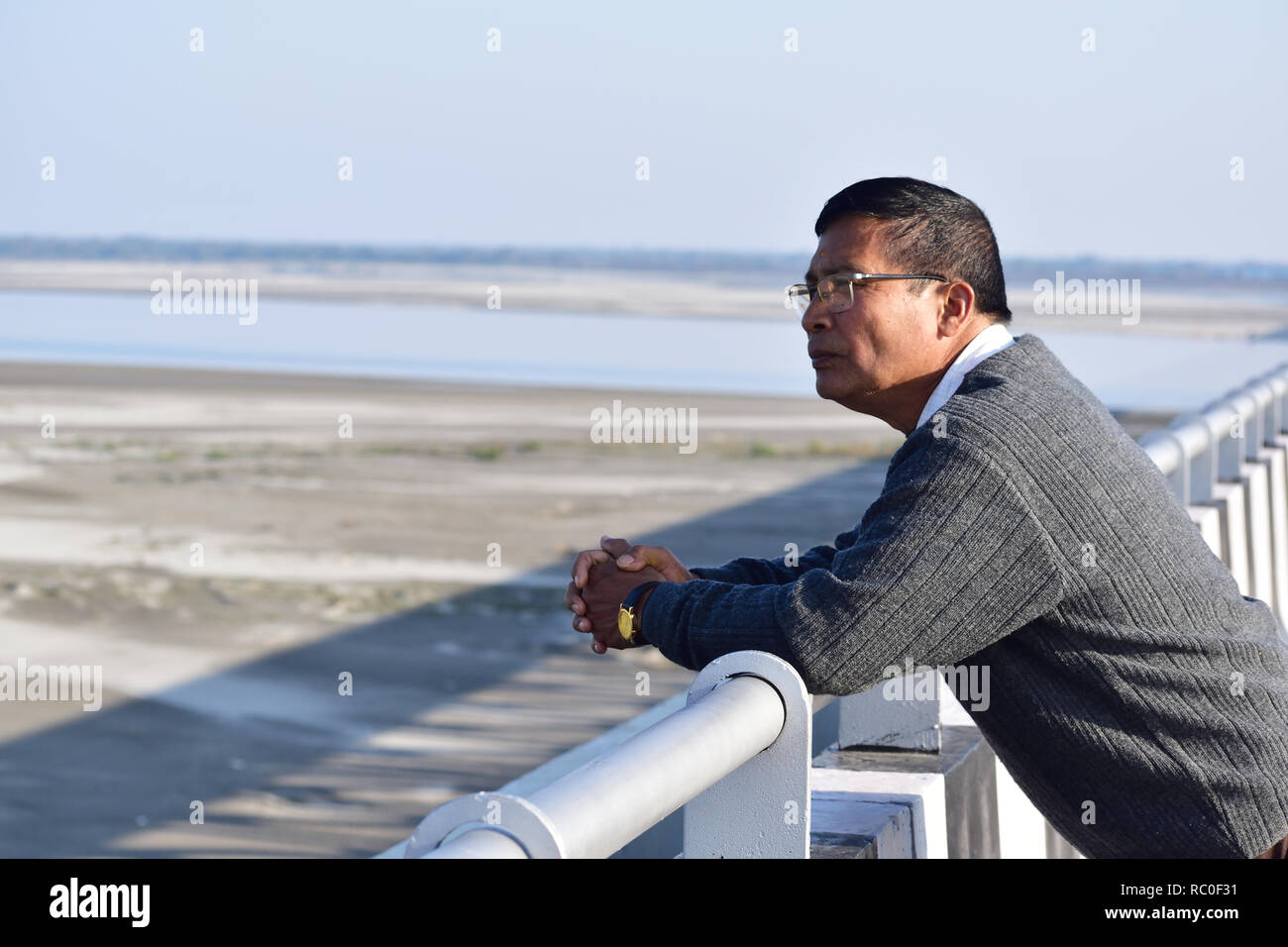 Person standing on a bridge hi-res stock photography and images - Alamy