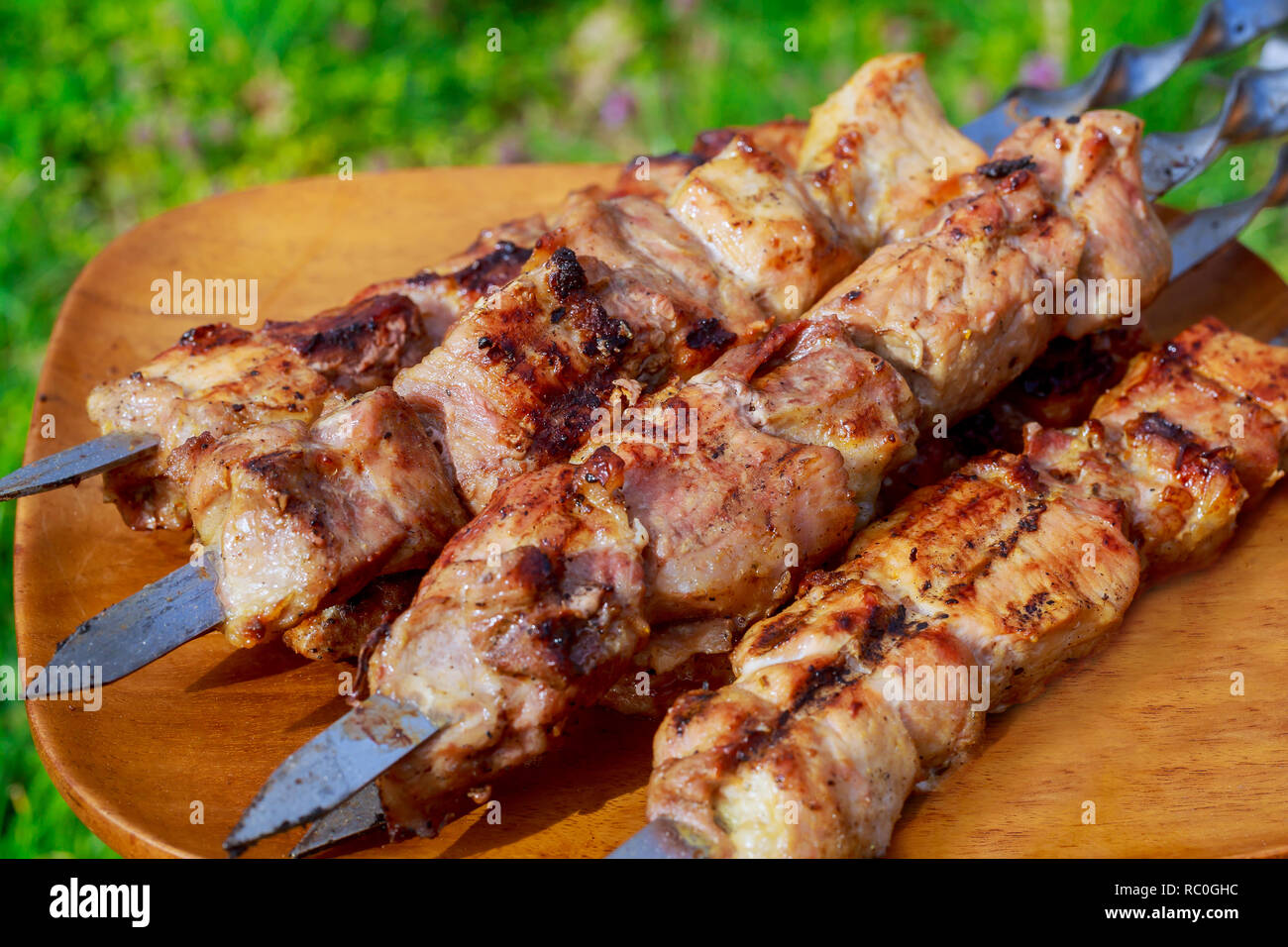 Shish kebab with the mix of spices on bbq cooking meat Stock Photo - Alamy