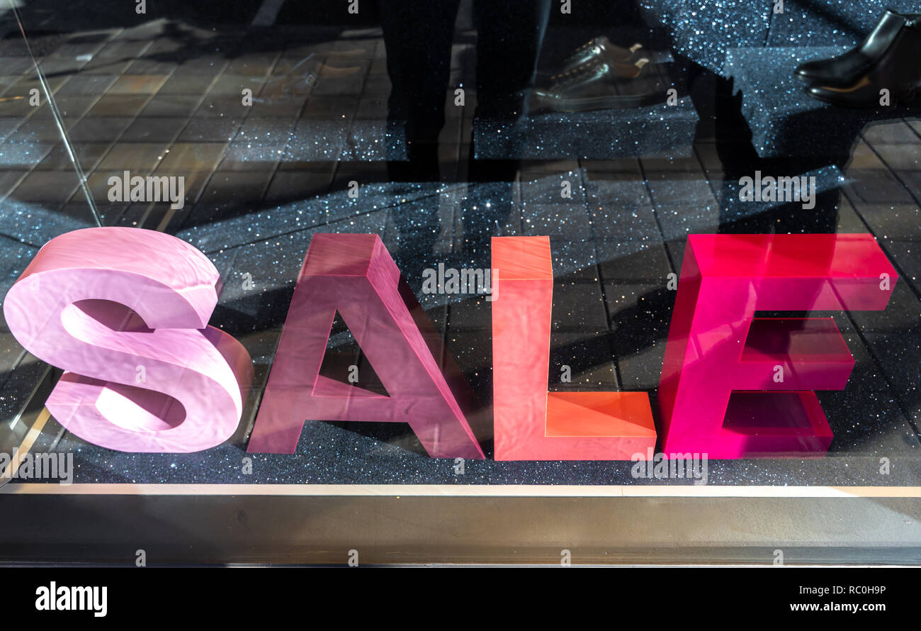 Sales sign on the vitrine. Big different colored letters saying sales ...