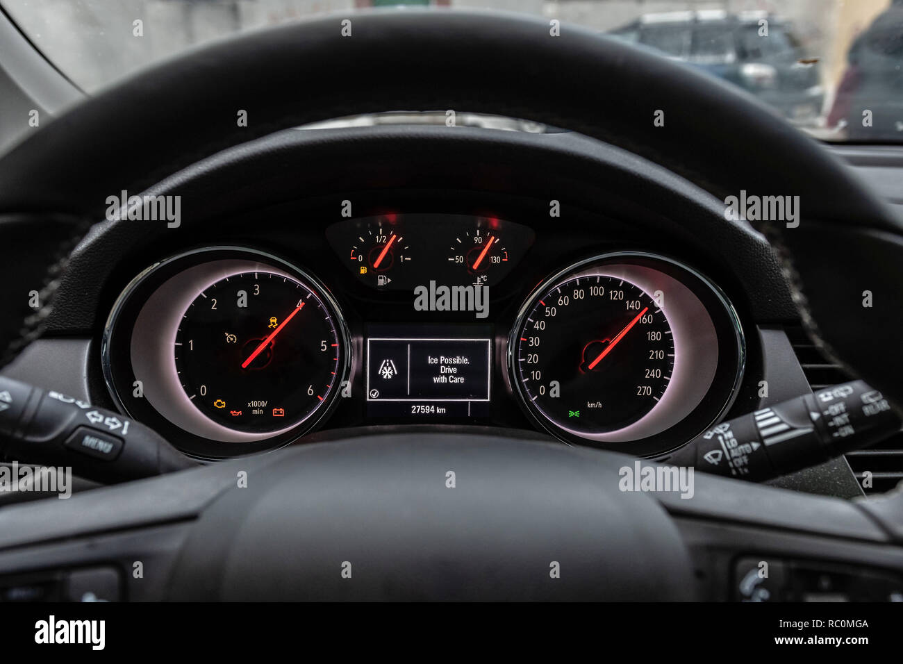 Car front instrument panel with warning of slippery roads Stock Photo ...