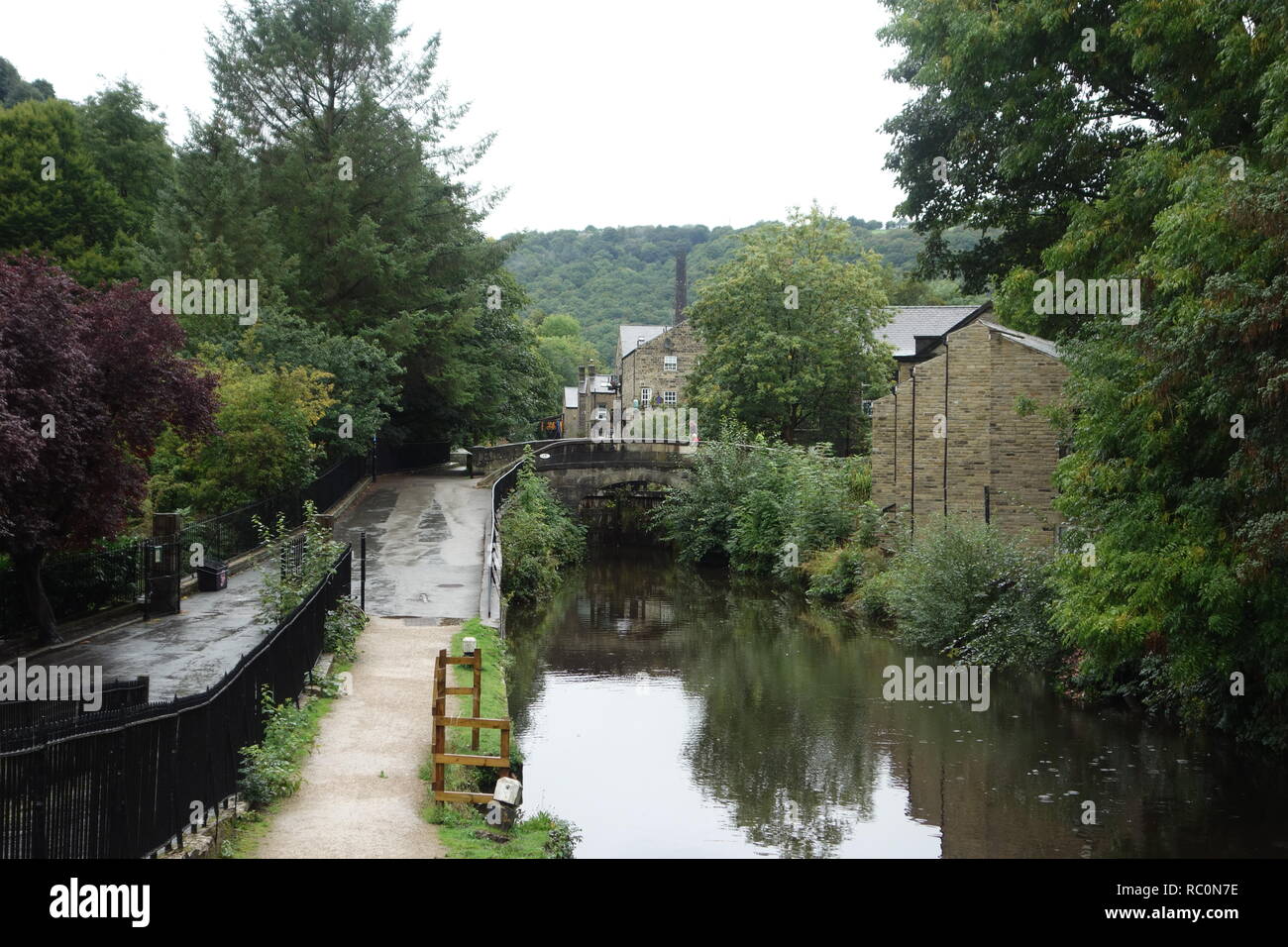 Canal side scene in Hebden Bridge, West Yorkshire, with pedestrian ...