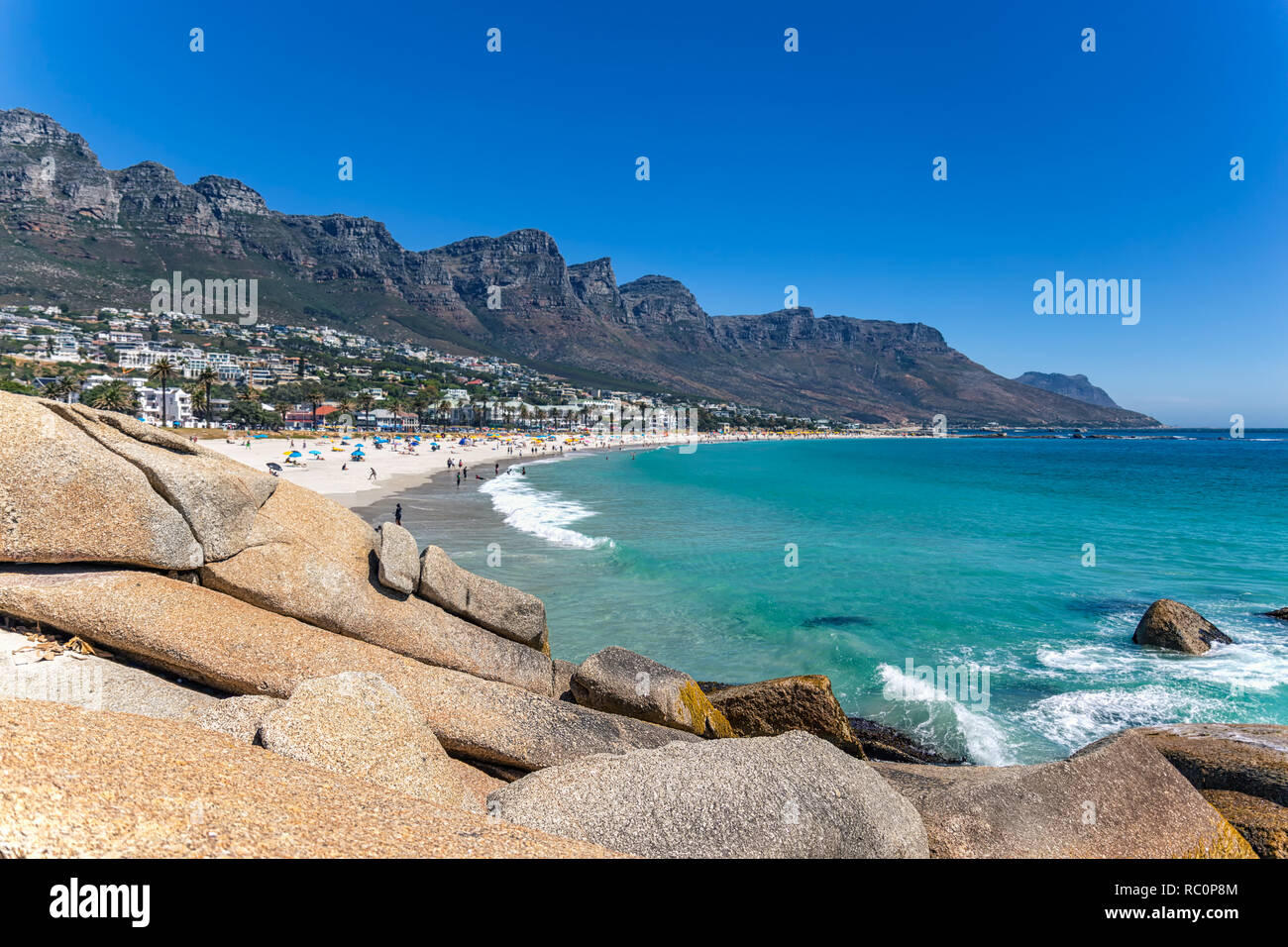 View Camps bay beautiful beach with turquoise water and mountains in ...