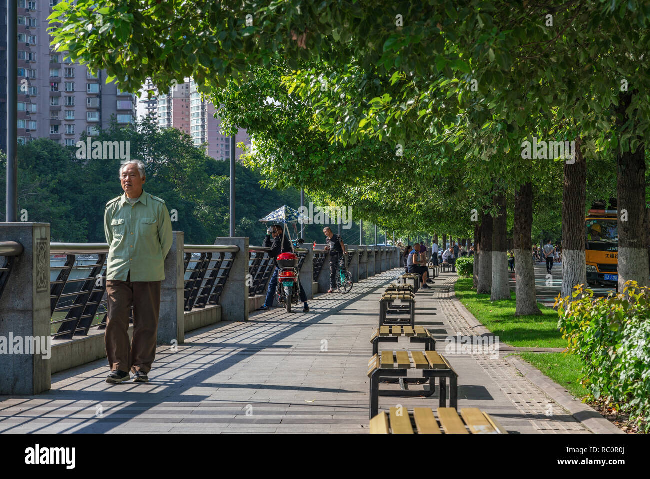 People walking on riverside path hi-res stock photography and images ...