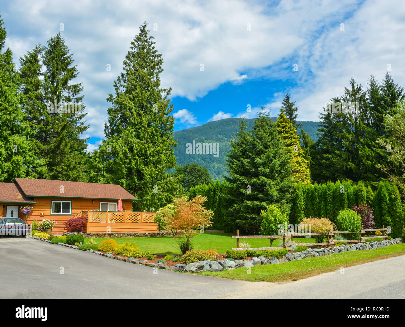 North American family house in rural area with nicely landscaped front ...