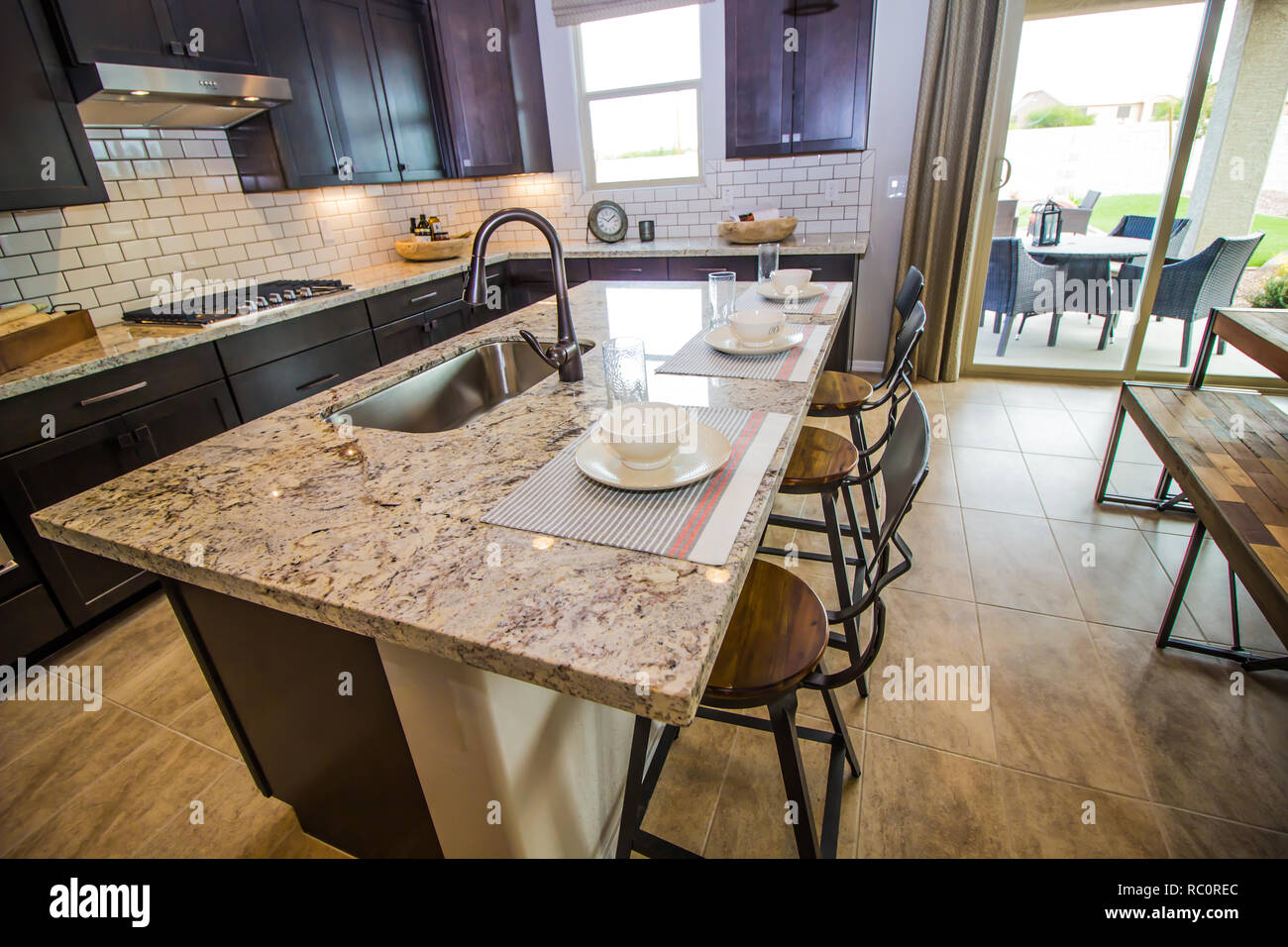Granite Counter Kitchen Island With Place Settings Stock Photo - Alamy