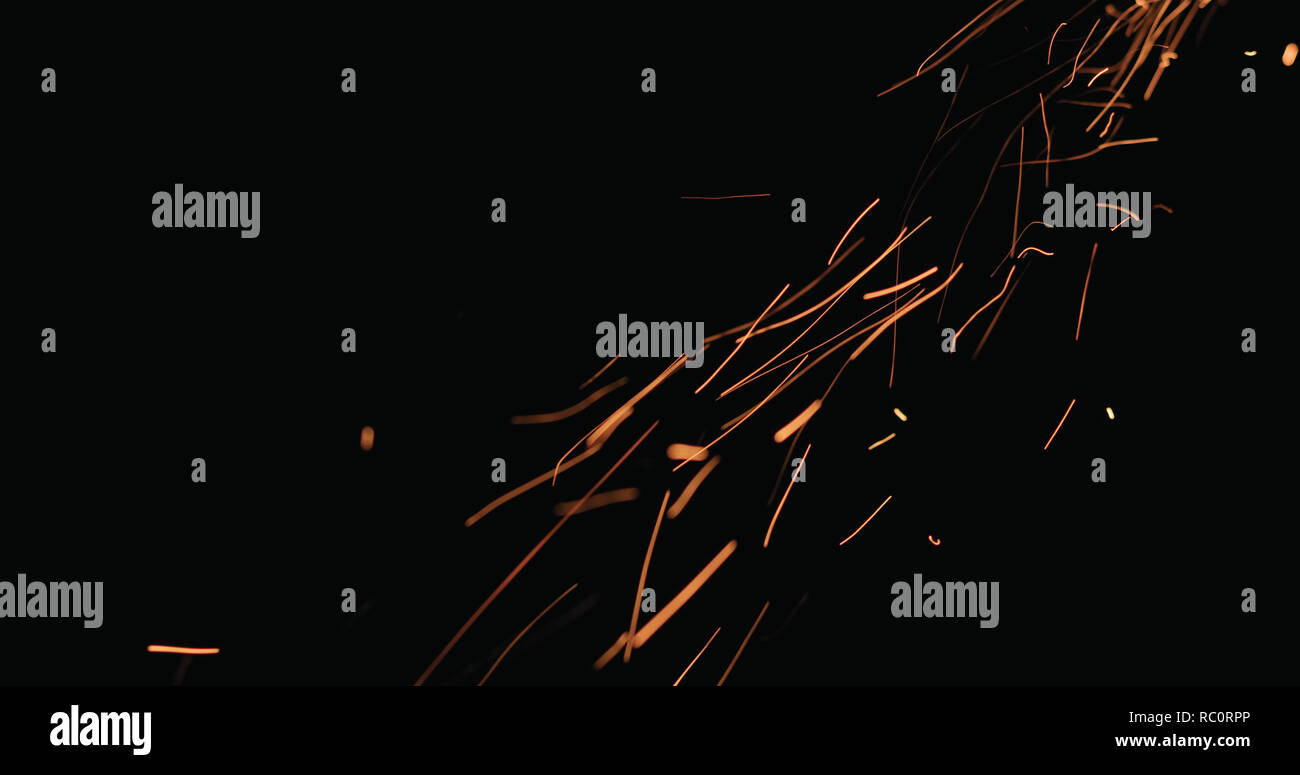 hot sparks falling from above black background, wide photo Stock Photo ...