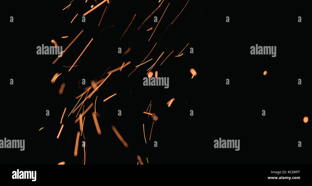 hot sparks falling from above black background, wide photo Stock Photo ...