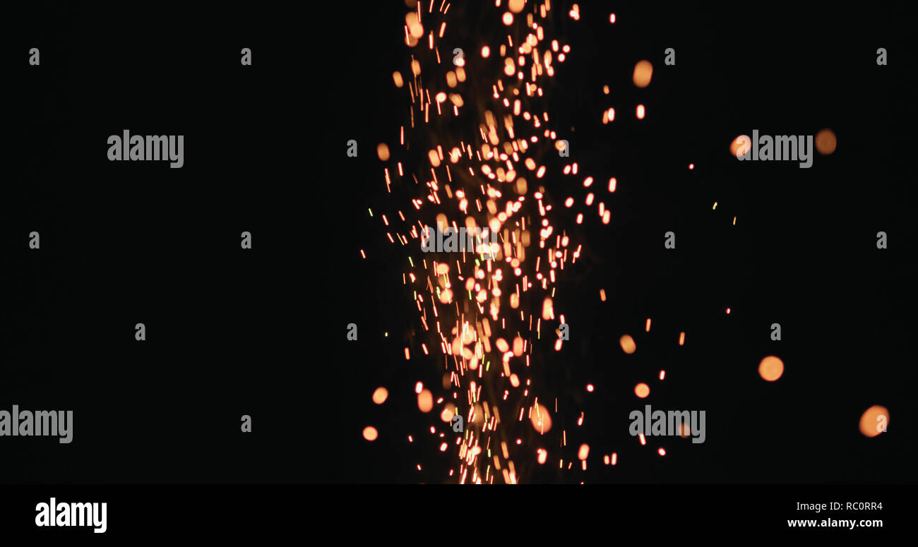 hot sparks slowly falling from above black background, wide photo Stock ...