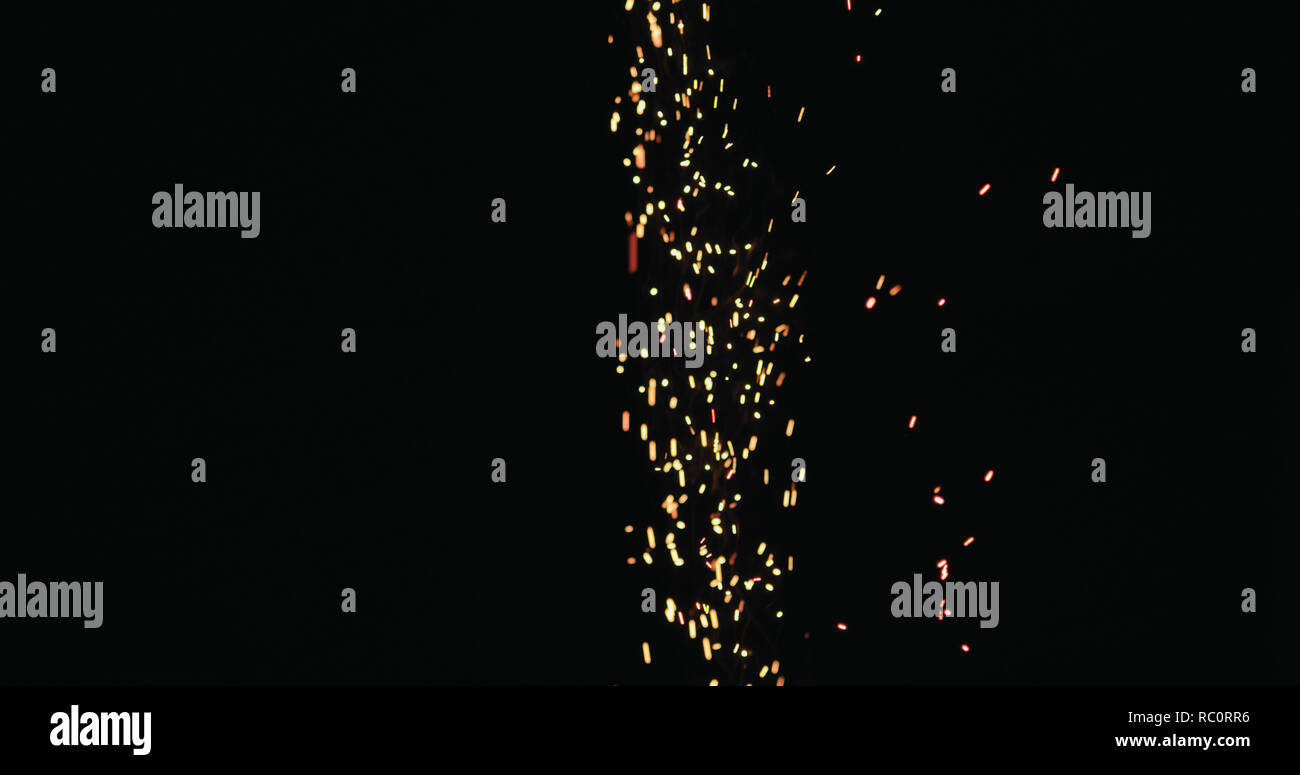 hot sparks slowly falling from above black background, wide photo Stock ...