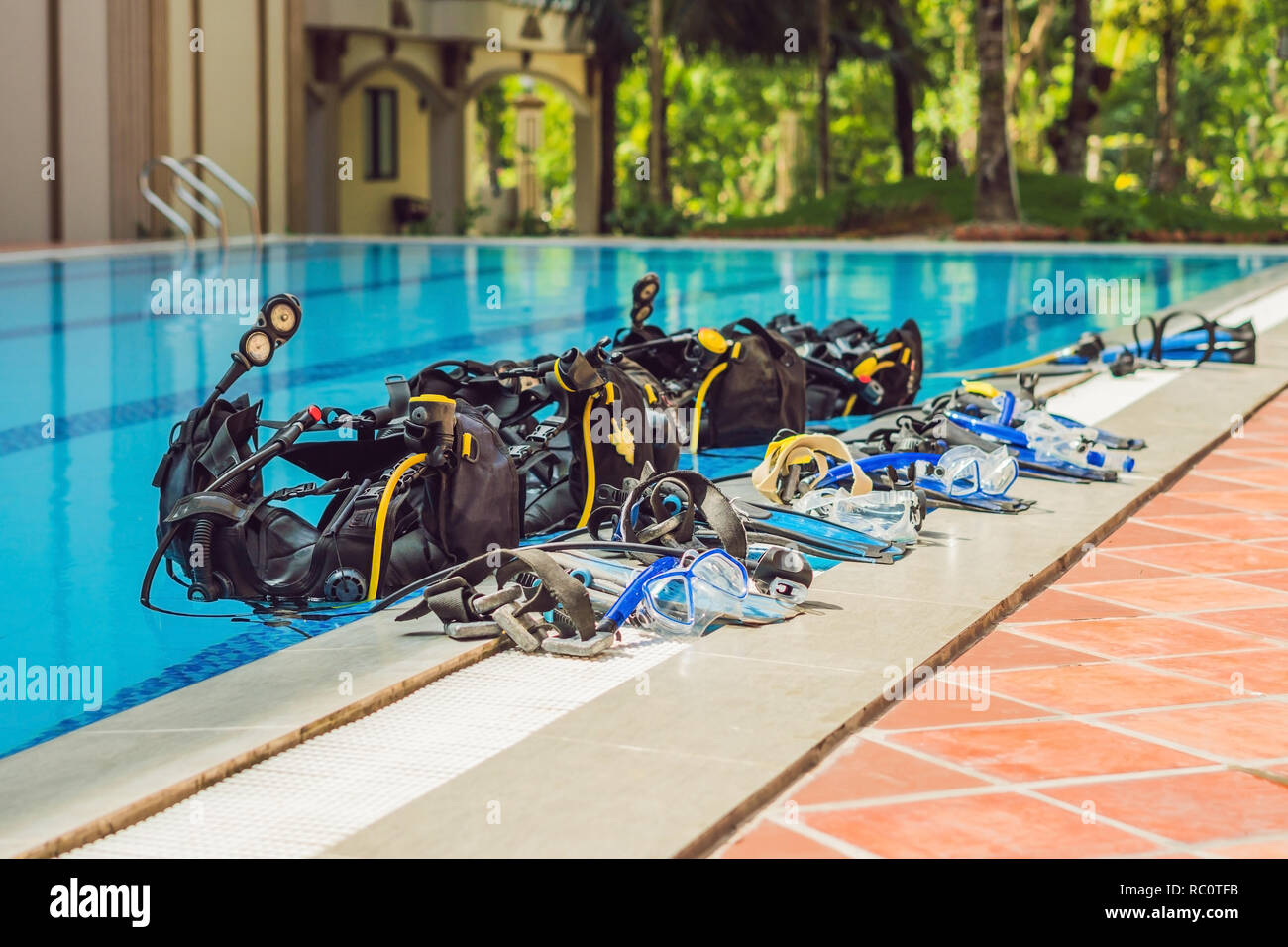 Equipment for diving is on the edge of the pool, ready for a lesson ...