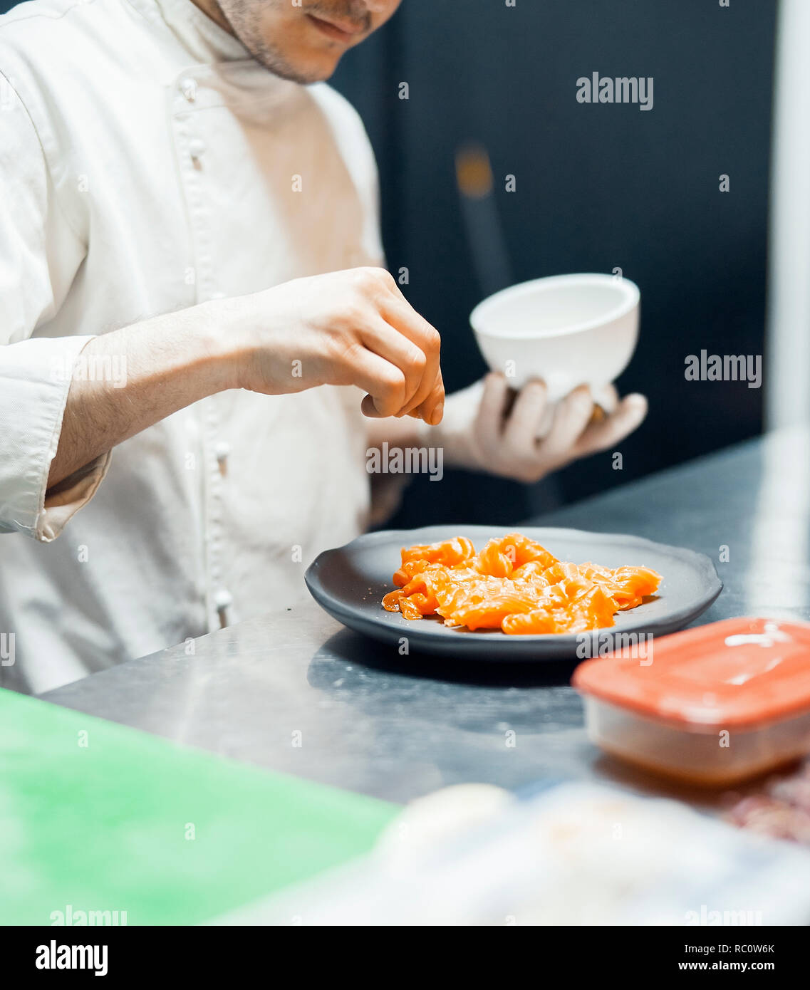 Restaurant kitchen chef salting piece hi-res stock photography and ...