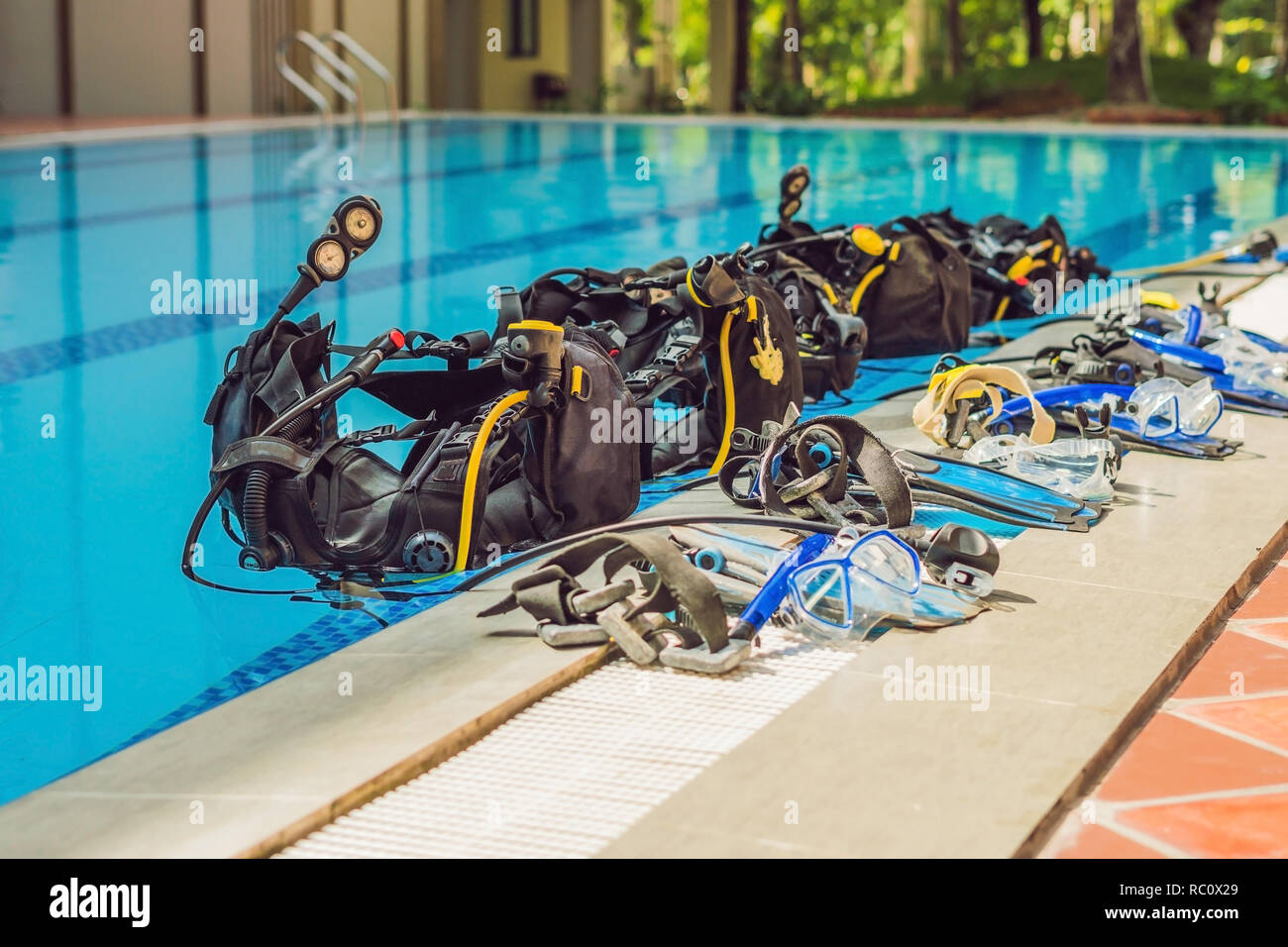 Equipment for diving is on the edge of the pool, ready for a lesson ...