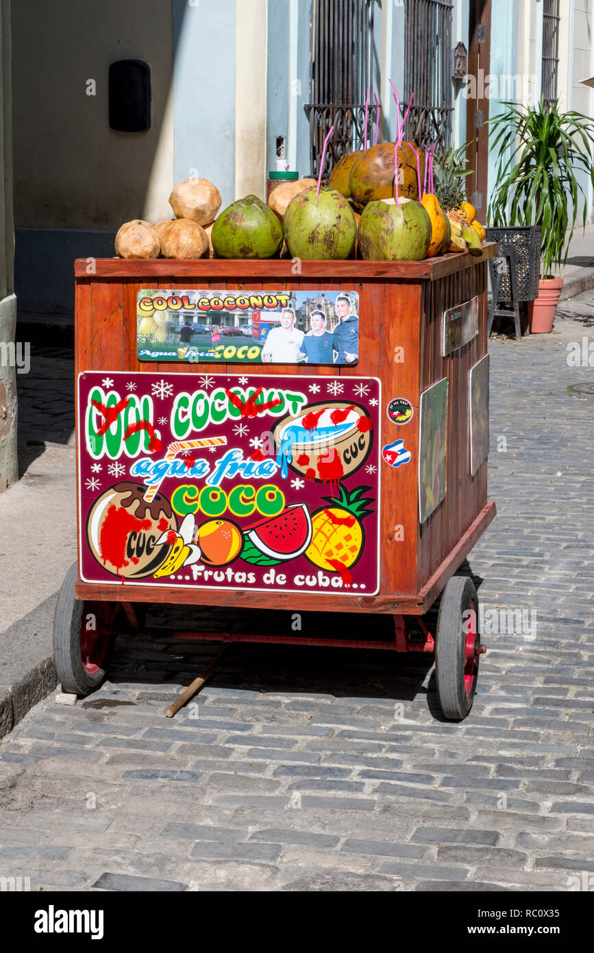 Street cart selling coconut water on a hot day in Havana, Cuba. Photo ...