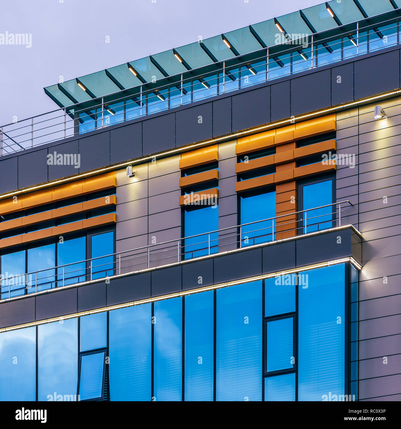 Modern high-rise office building with a glass facade at overcast ...