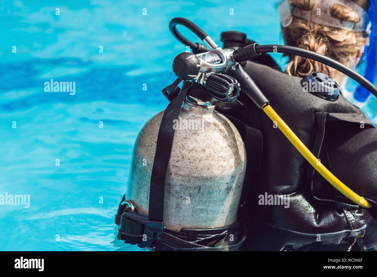 grey scuba diving air oxygen tank on the back of a scuba diver Stock ...