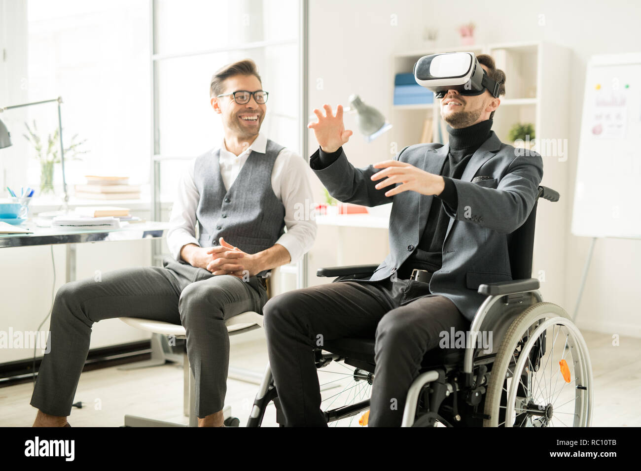 Business people testing gadgets Stock Photo - Alamy