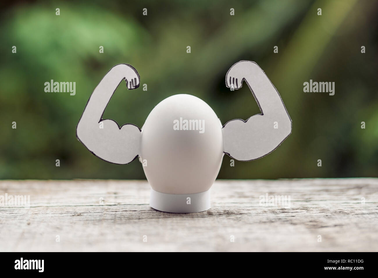 Egg with muscles, concept of egg protein, sports nutrition, diet for ...