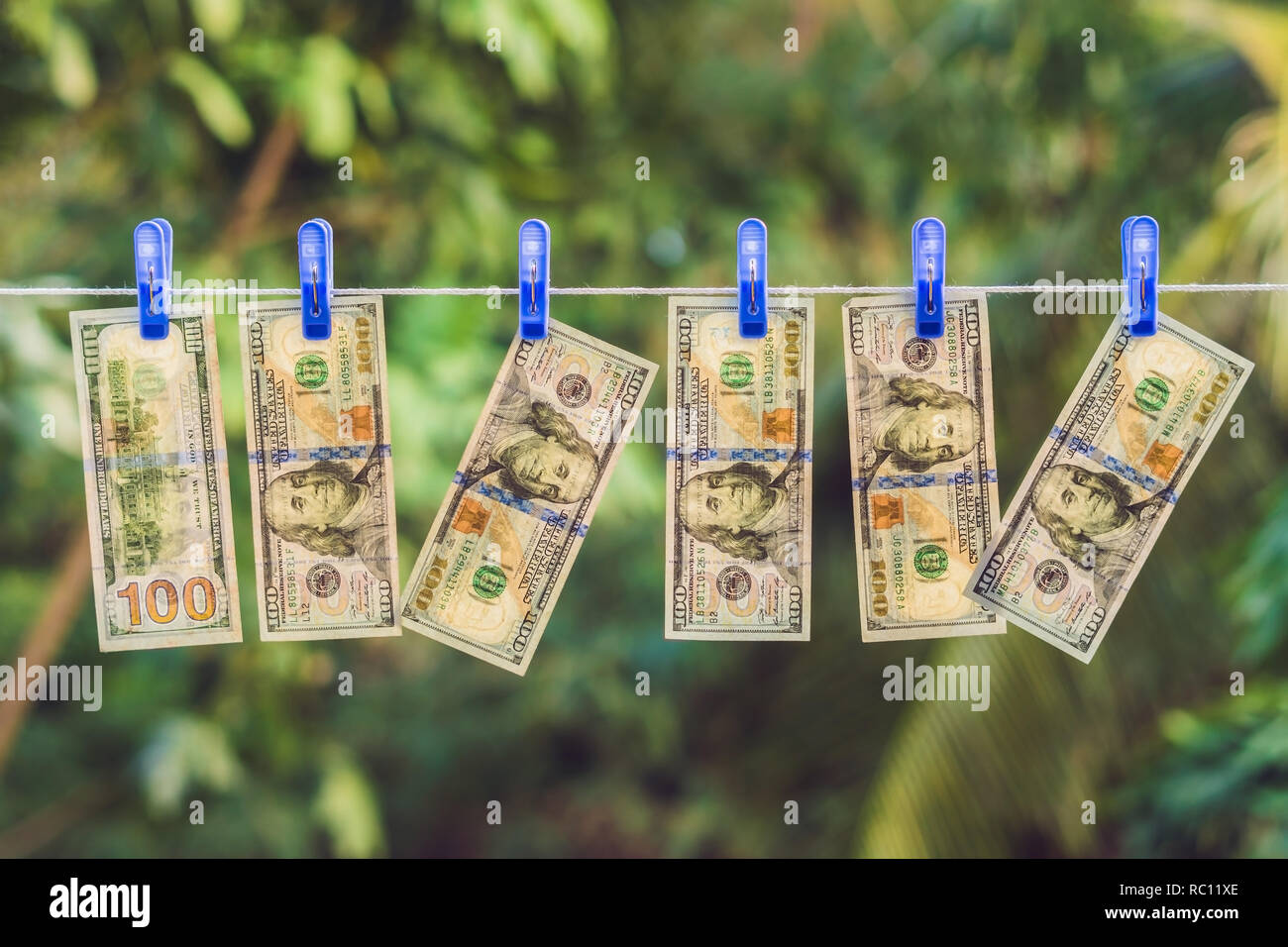 Money Laundering US dollars hung out to dry Stock Photo - Alamy