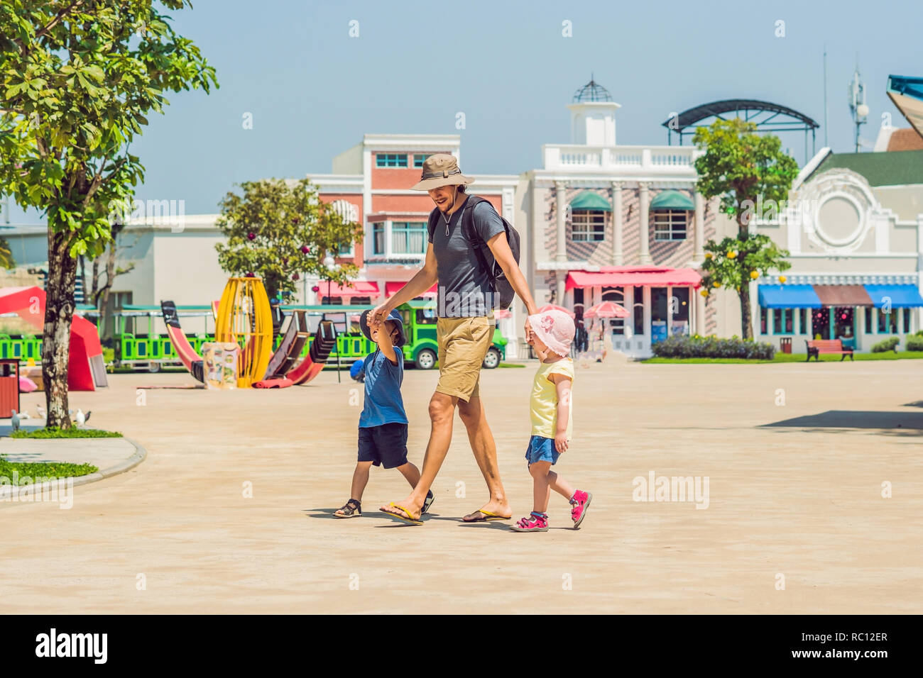 Happy family having fun in the park Stock Photo - Alamy