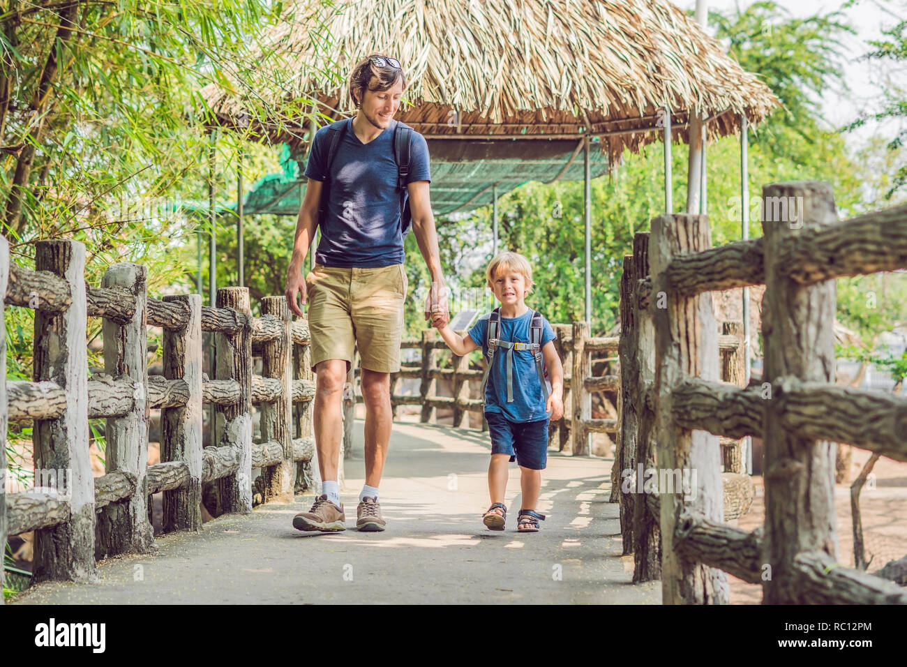 Father and son at the zoo. Spending day with family at the zoo Stock ...